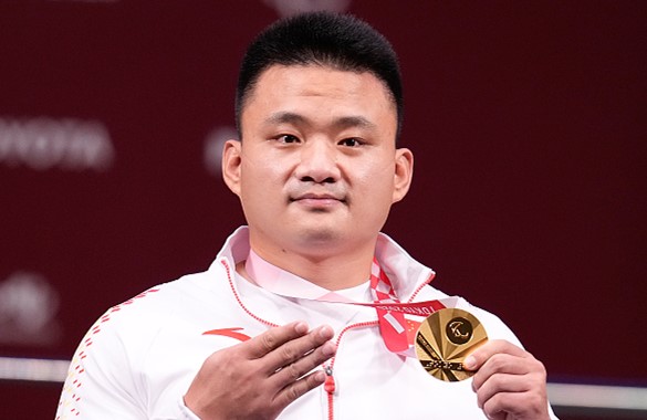 Chinese powerlifting gold medalist Liu Lei sets example for his son ...